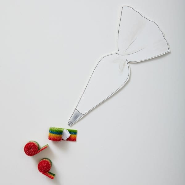 Step 1 Roll sour candy belt into spool. Secure end with dot of royal icing.