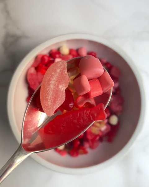 Pour them into a bowl, and mix the Candy Salad with salad servers.