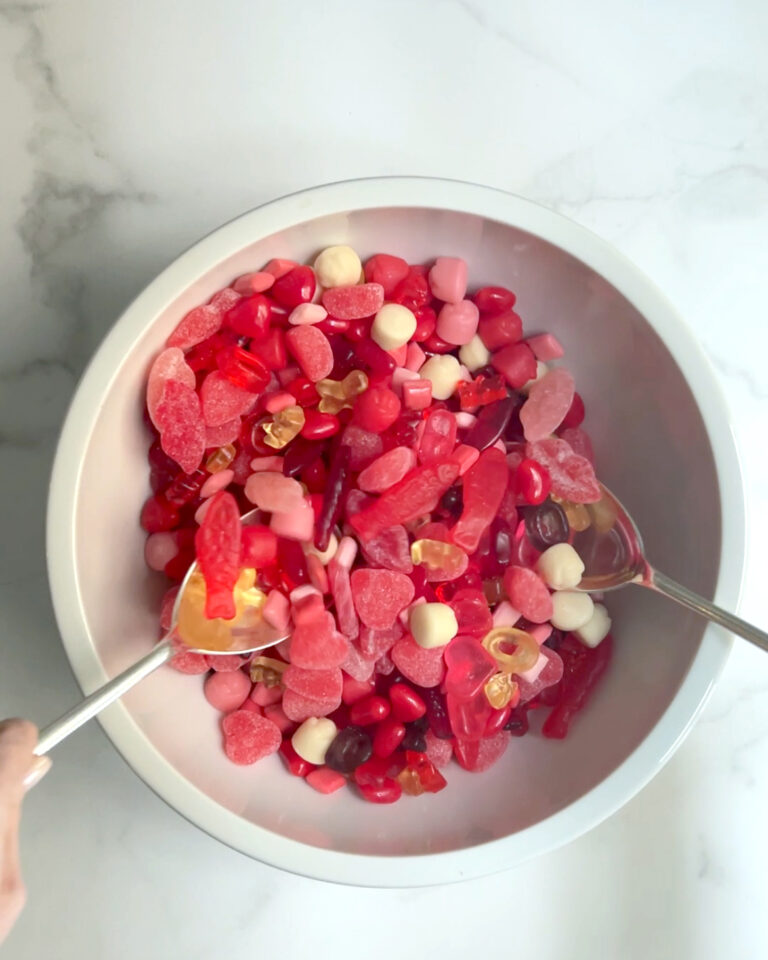 Pour them into a bowl, and mix the Candy Salad with salad servers.